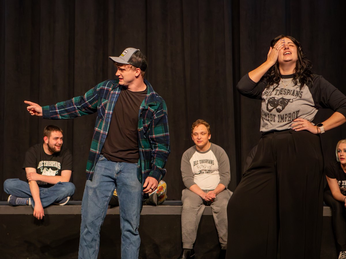 Taylor Wilburn (Benton) and an audience member improvise a lively scene ...